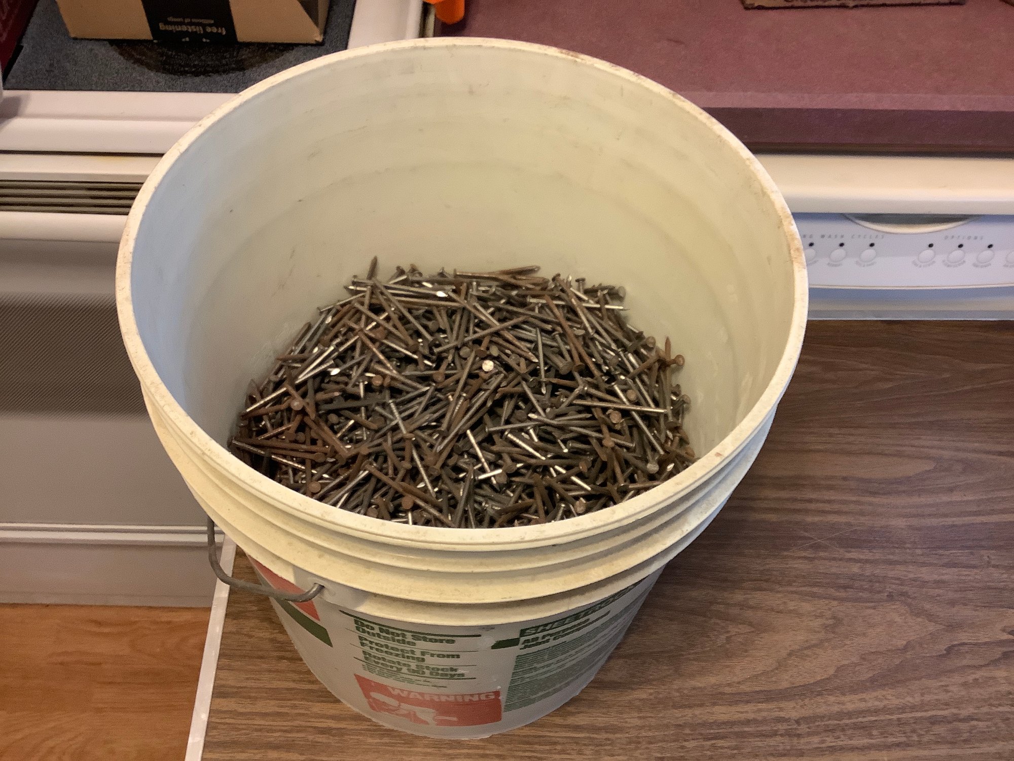 1/2 Of A Joint Compound Bucket Of Nails #12209 | Auctionninja.com